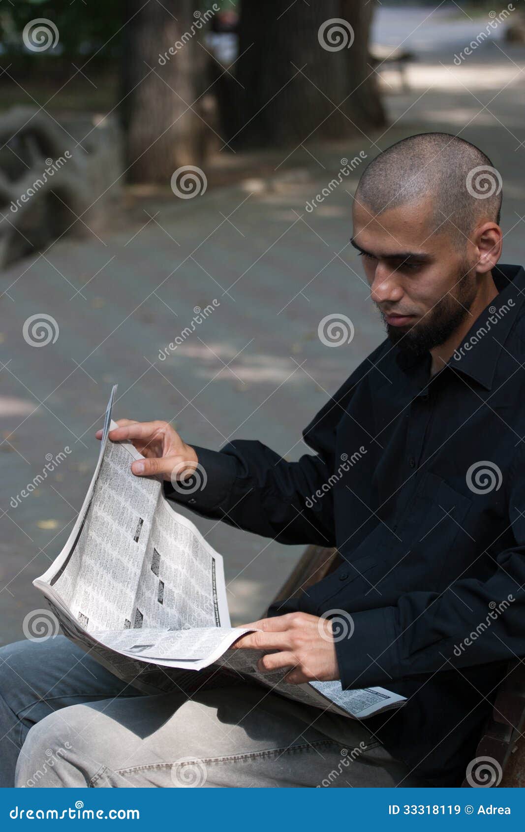 Man Reading a Newspaper on a Bench in a Park Stock Image - Image of ...