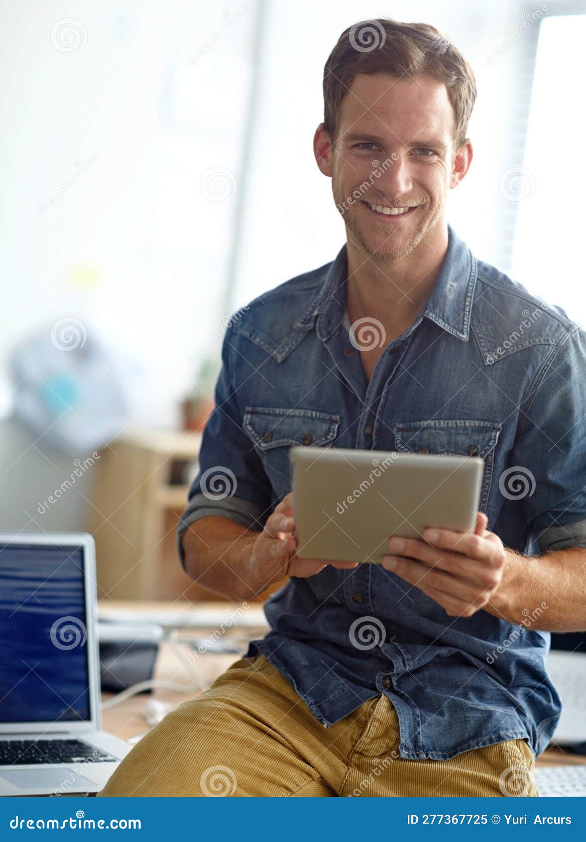 Reading the daily News. a Young Man Reading His Text Messages while ...