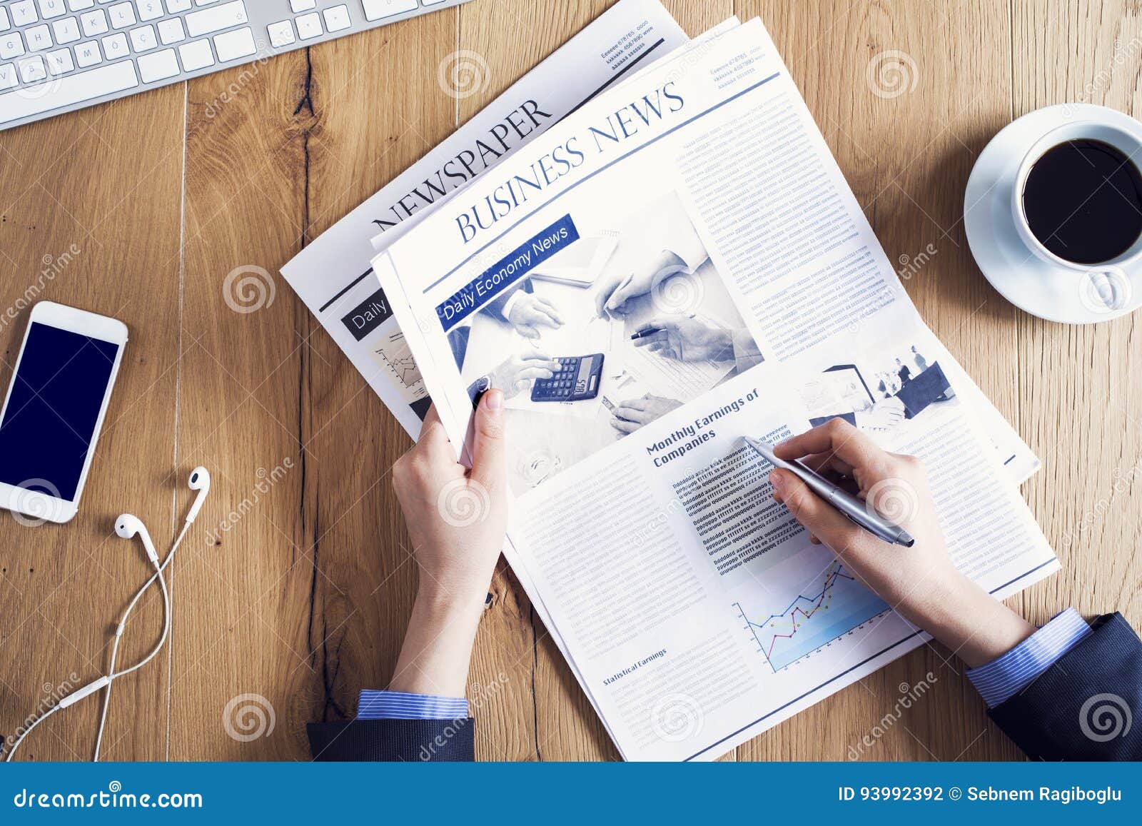 Reading newspaper on desk stock photo. Image of person - 93992392