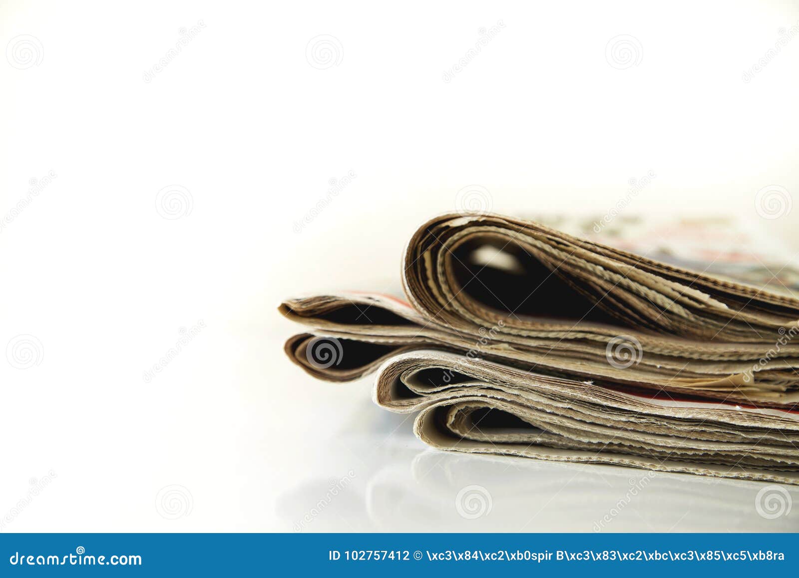 Reading newspaper on table stock photo. Image of journal - 102757412