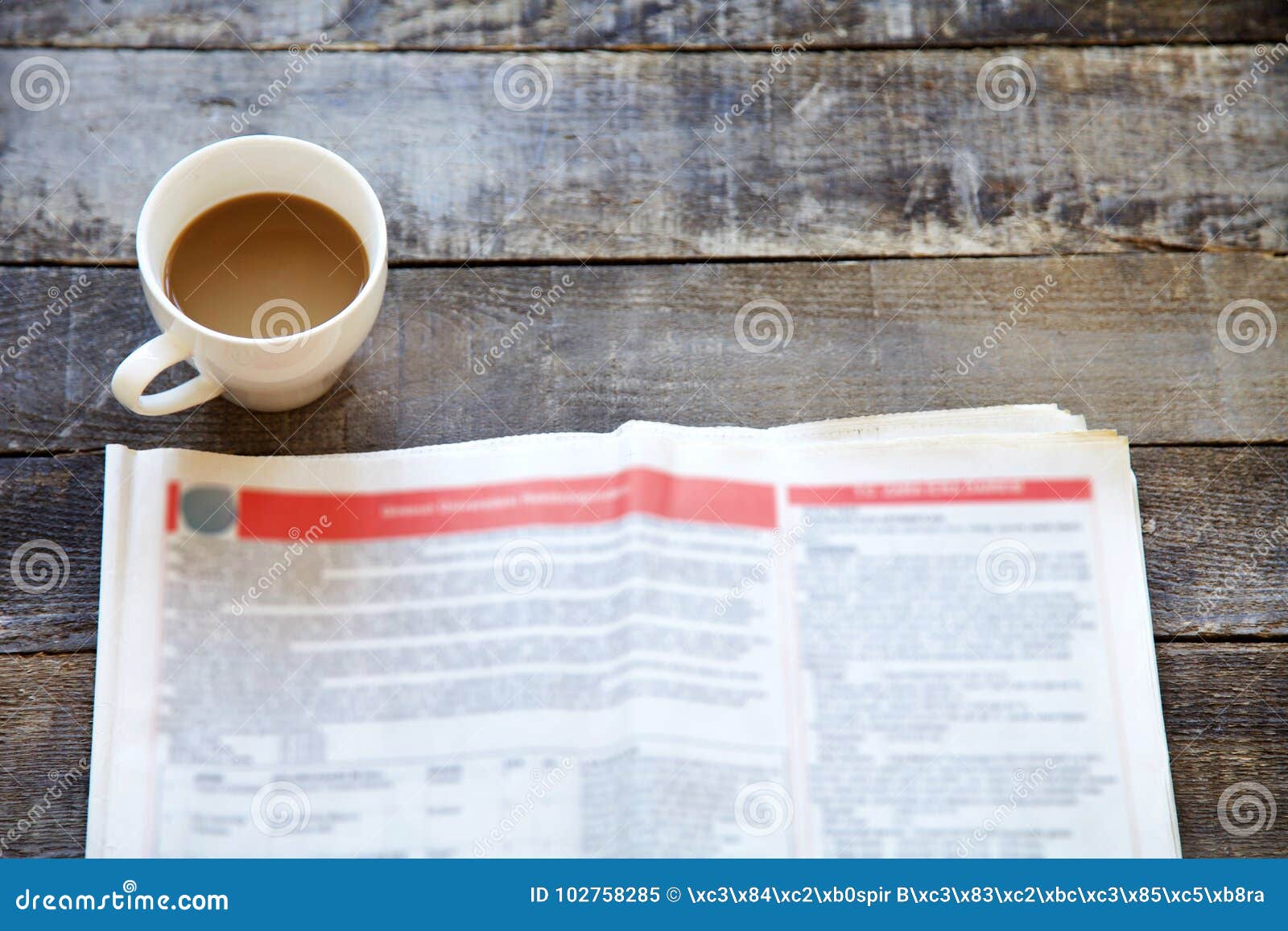 Reading newspaper on table stock image. Image of view - 102758285