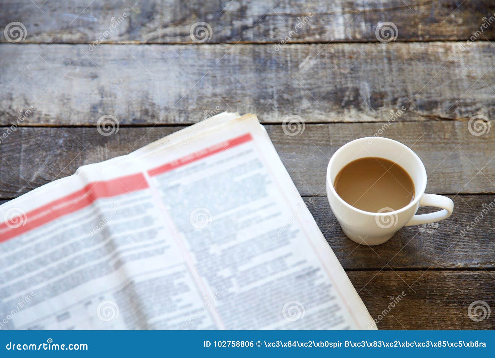 Reading newspaper on table stock photo. Image of newspaper - 102758806