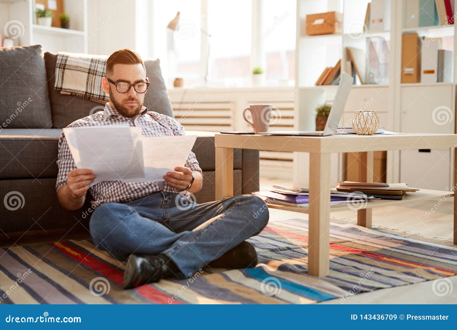 Reading papers at home stock image. Image of table, confident - 143436709