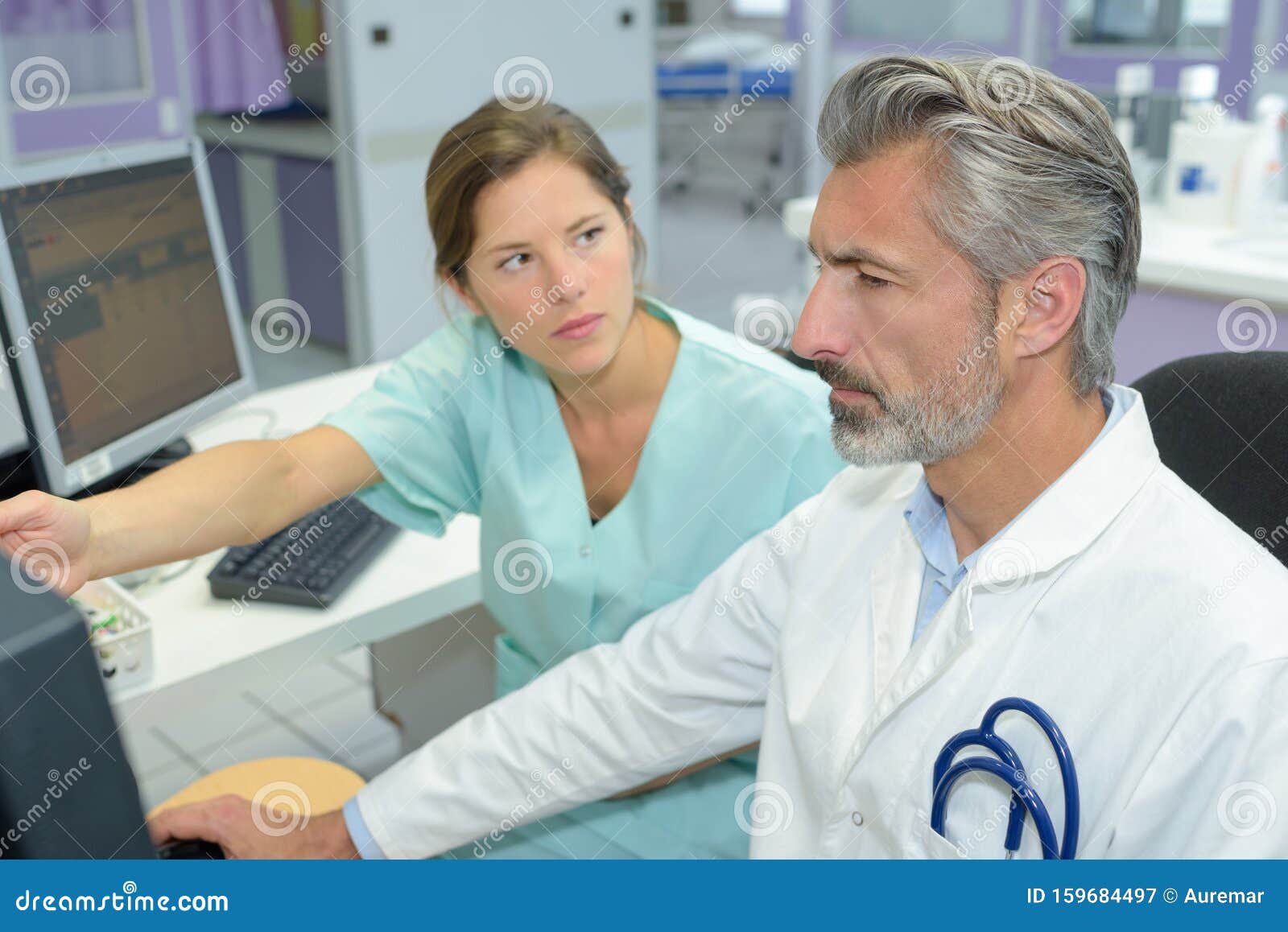 Reading Patient Notes at Nurses Station Stock Image - Image of ...