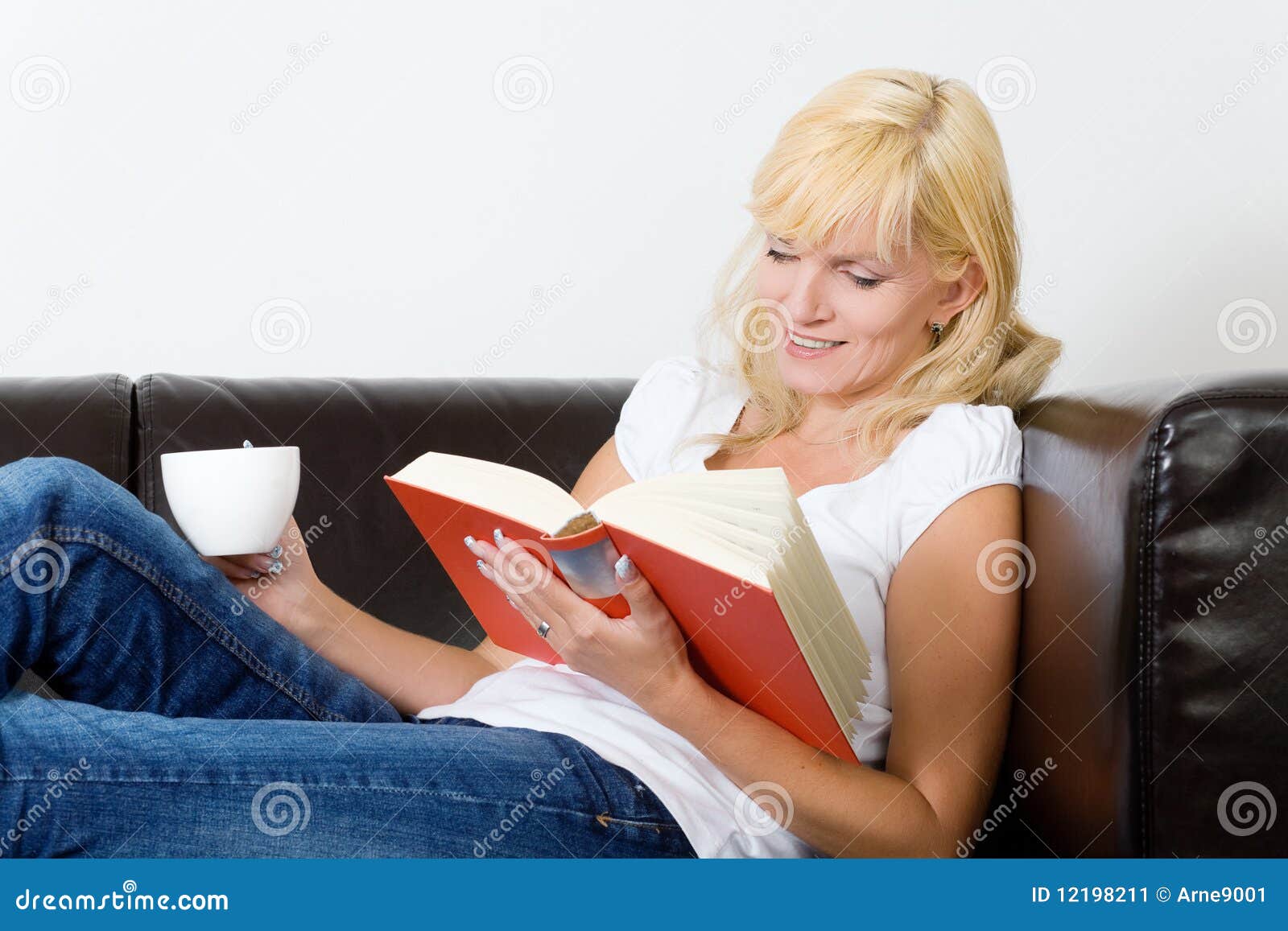 Reading on the sofa stock image. Image of reading, relaxed - 12198211