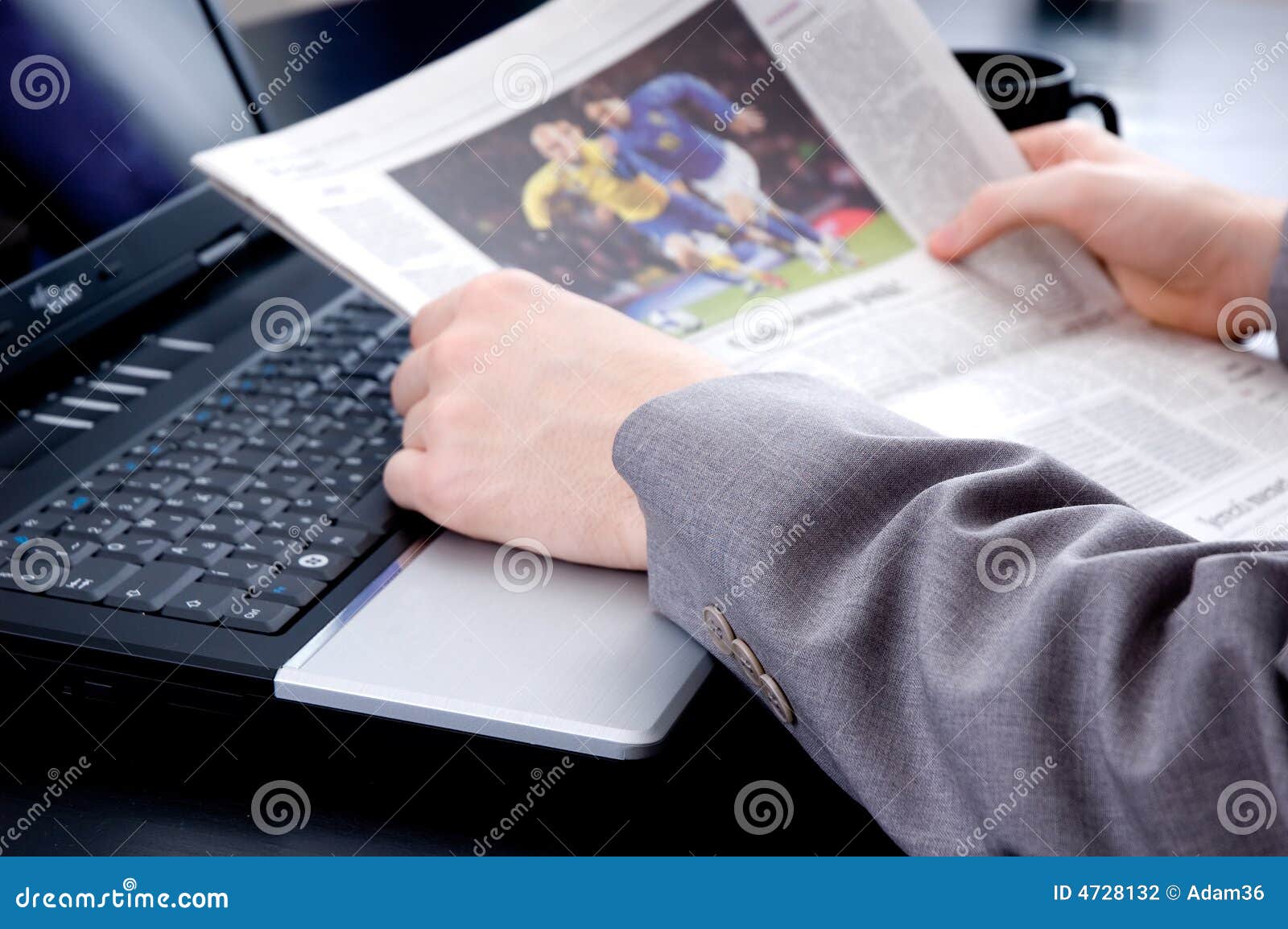 Reading the sports news stock photo. Image of online, news - 4728132