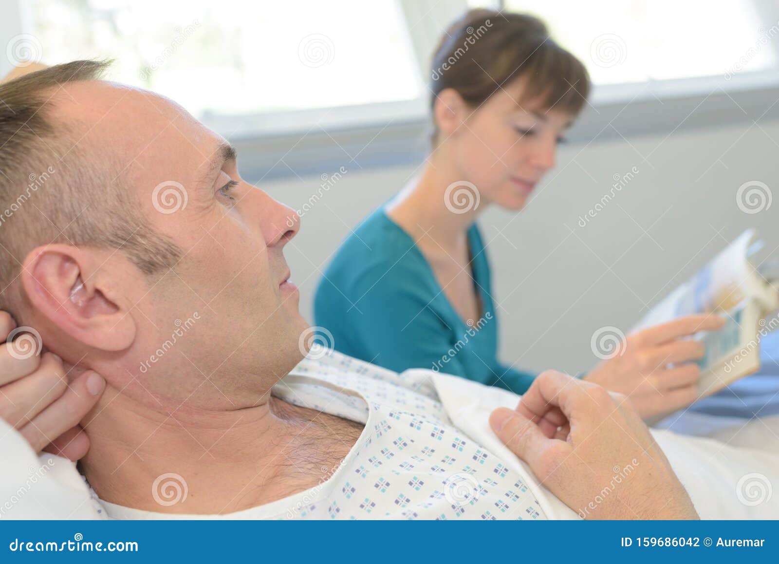 Reading story to patient stock photo. Image of healthcare - 159686042