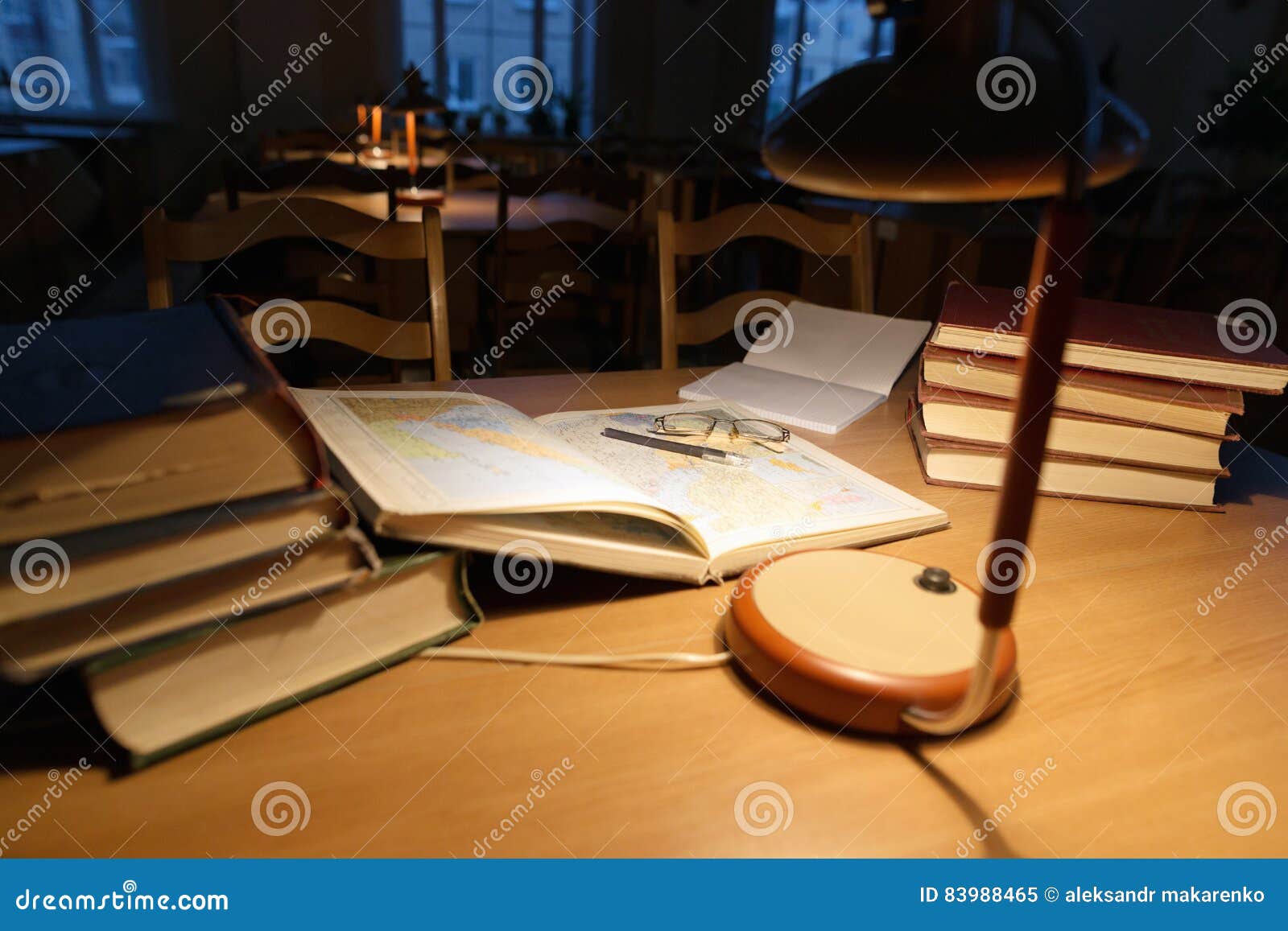 Reading at the Table with a Lamp in the Library Stock Image - Image of ...