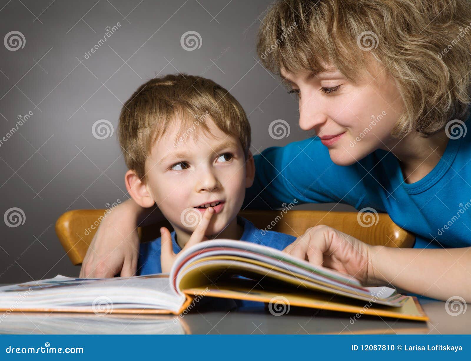 Reading together stock photo. Image of book, sitting - 12087810