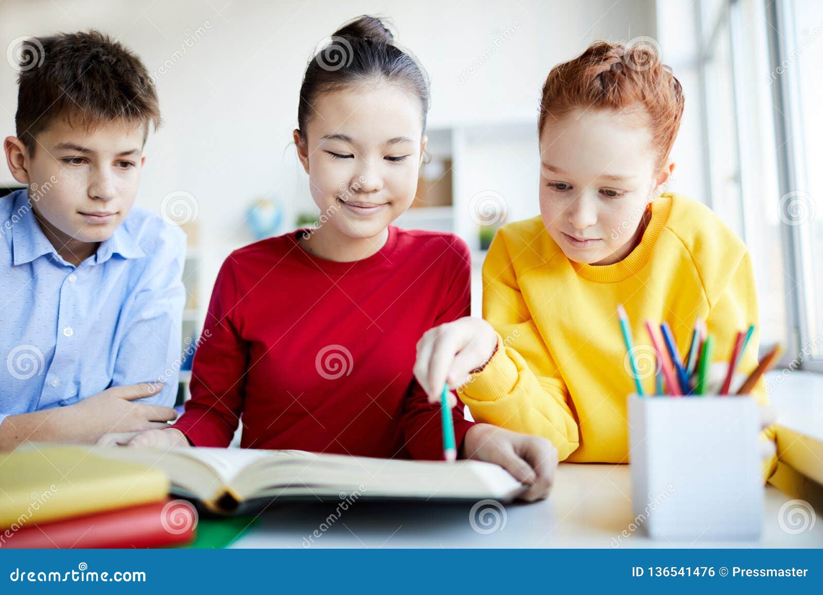 Reading together stock photo. Image of reading, classmate - 136541476