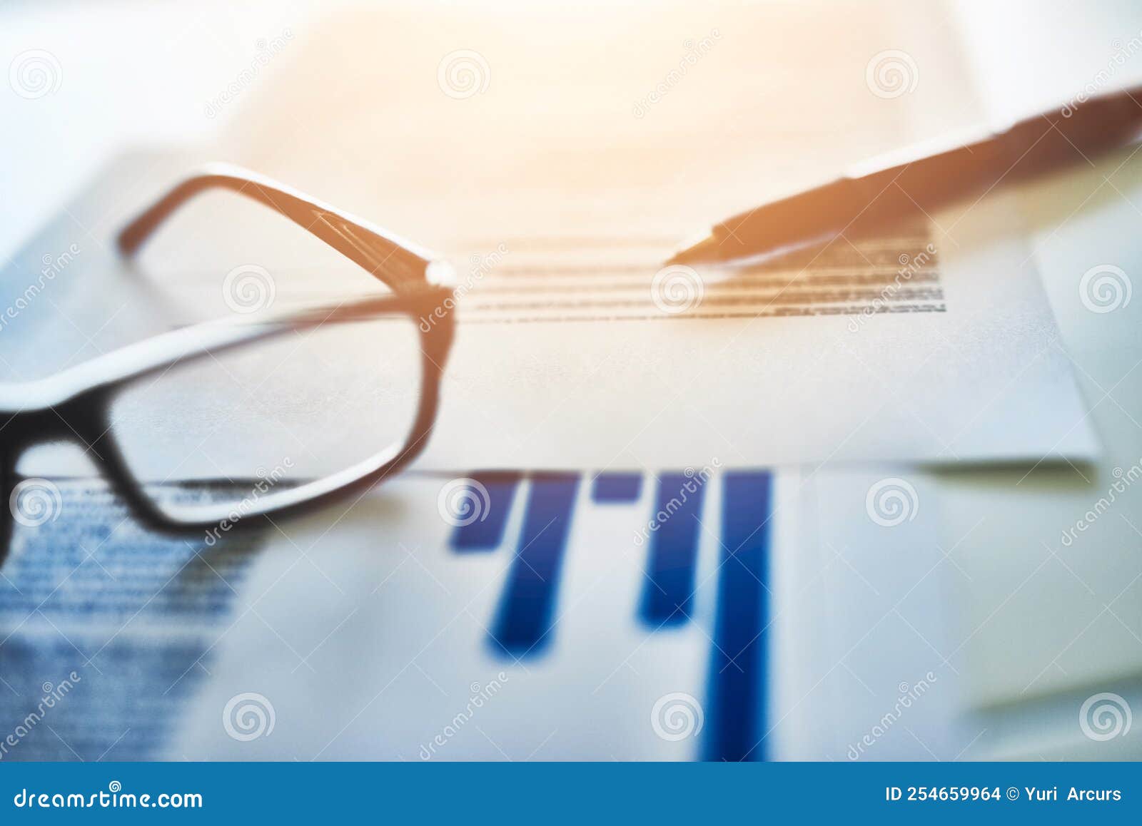 Reading Up on the Latest Reports. Closeup Shot of Spectacles and ...