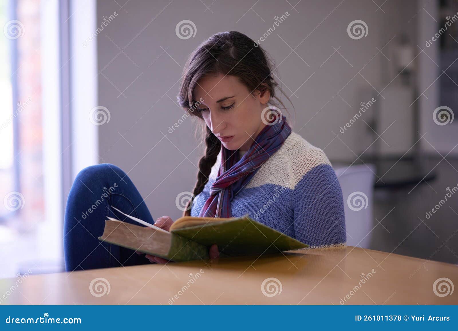 Reading Up on Some Notes for Her Next Class. a University Student ...