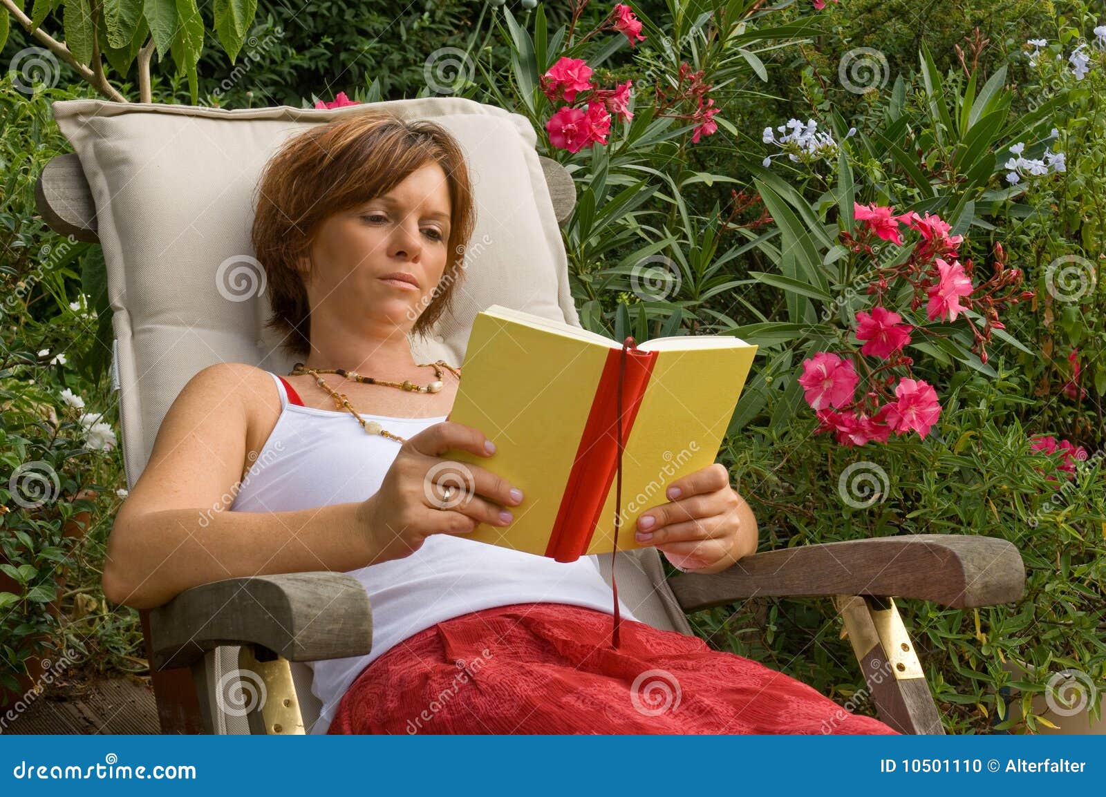 Reading woman stock photo. Image of oleander, floral - 10501110