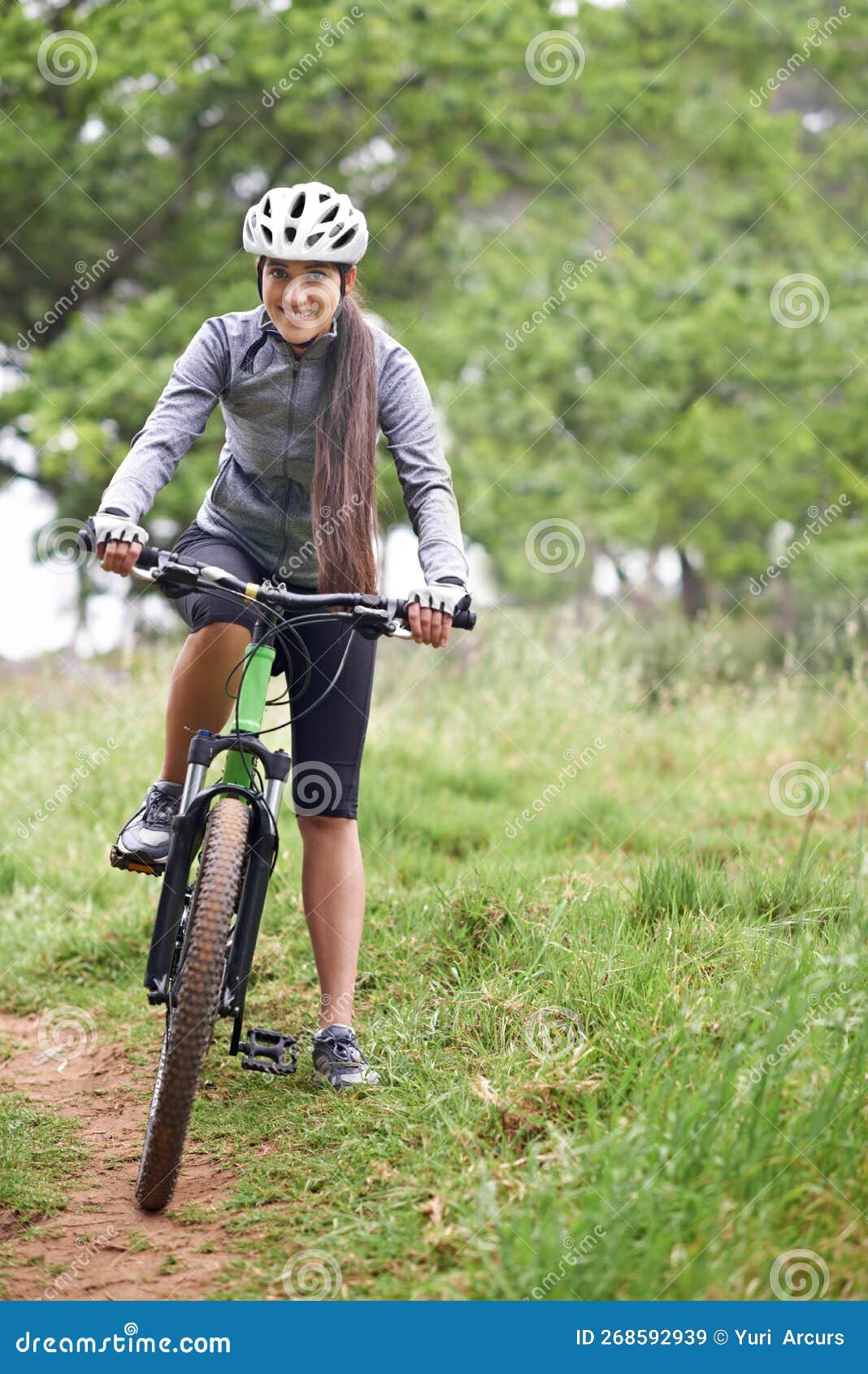 Ready for Adventures on the Trail. an Attractive Female Cyclist Riding ...