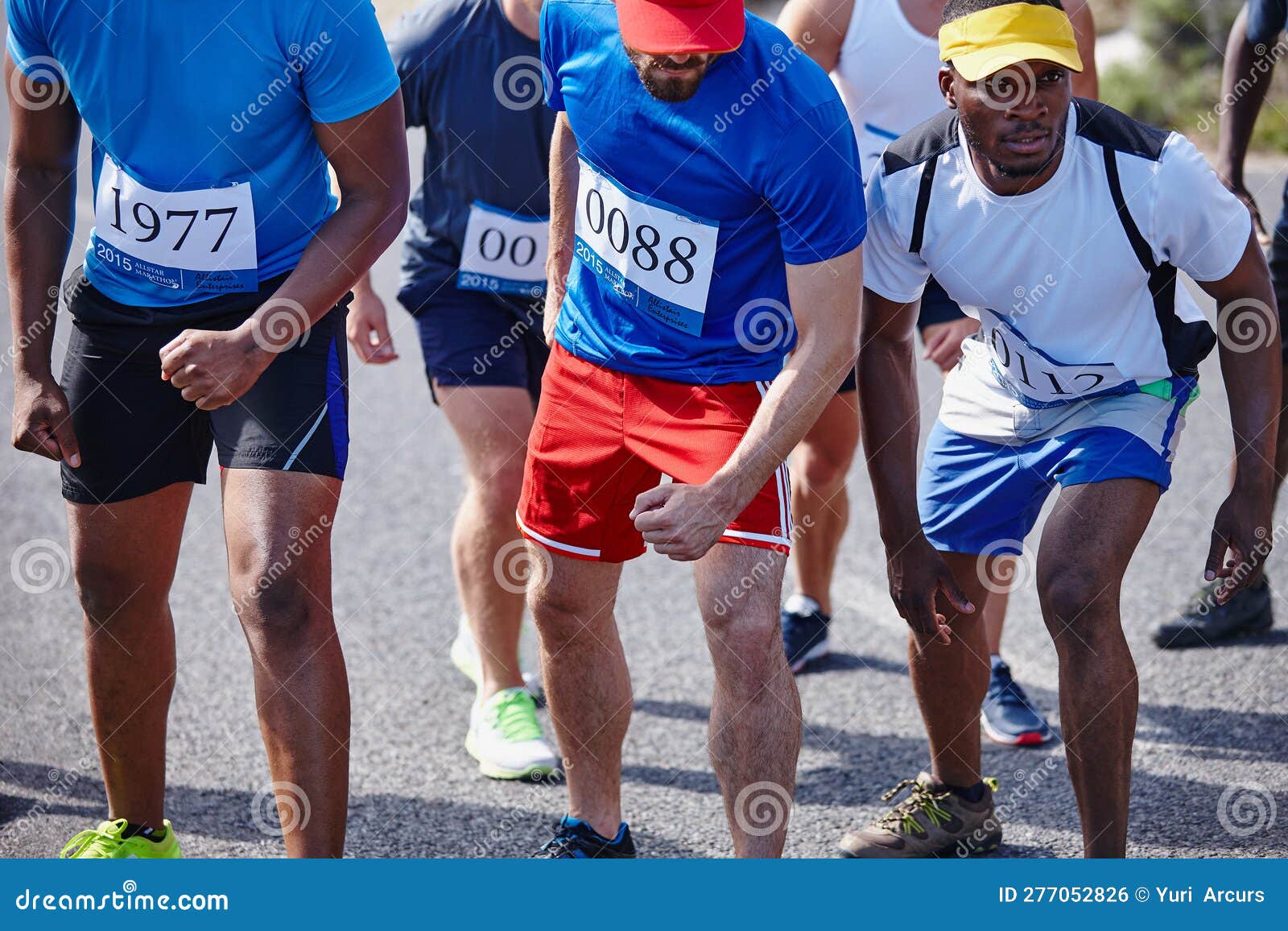 Ready for the Challenge. a Group of Young Men Competing in a Marathon ...