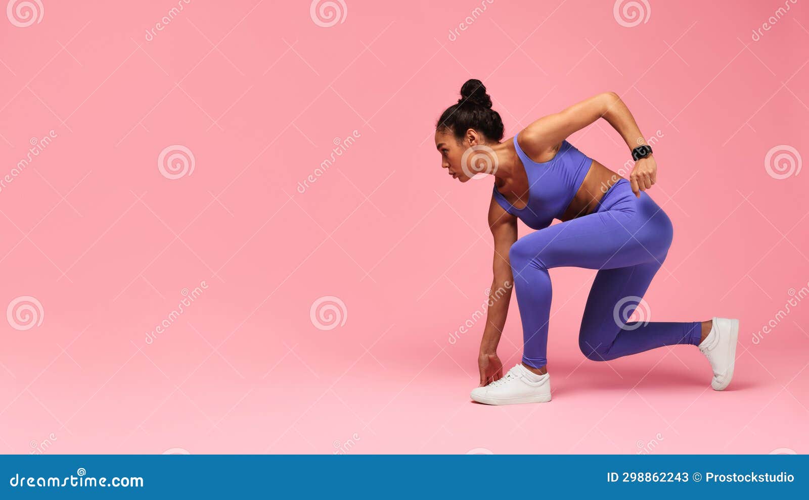 Motivated Black Lady Runner Doing Crouch Start on Pink Background Stock ...