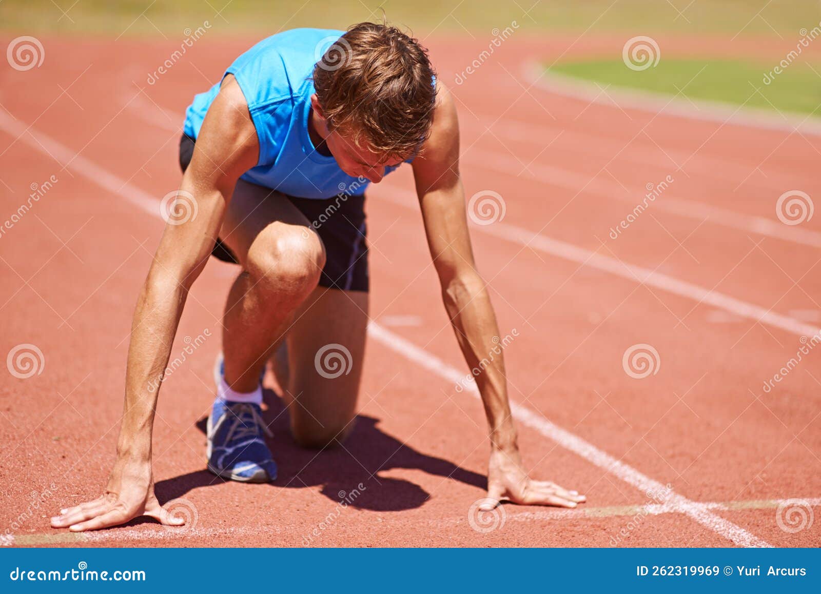 Ready for the Race. a Young Male Athlete at the Start of a Track Race ...