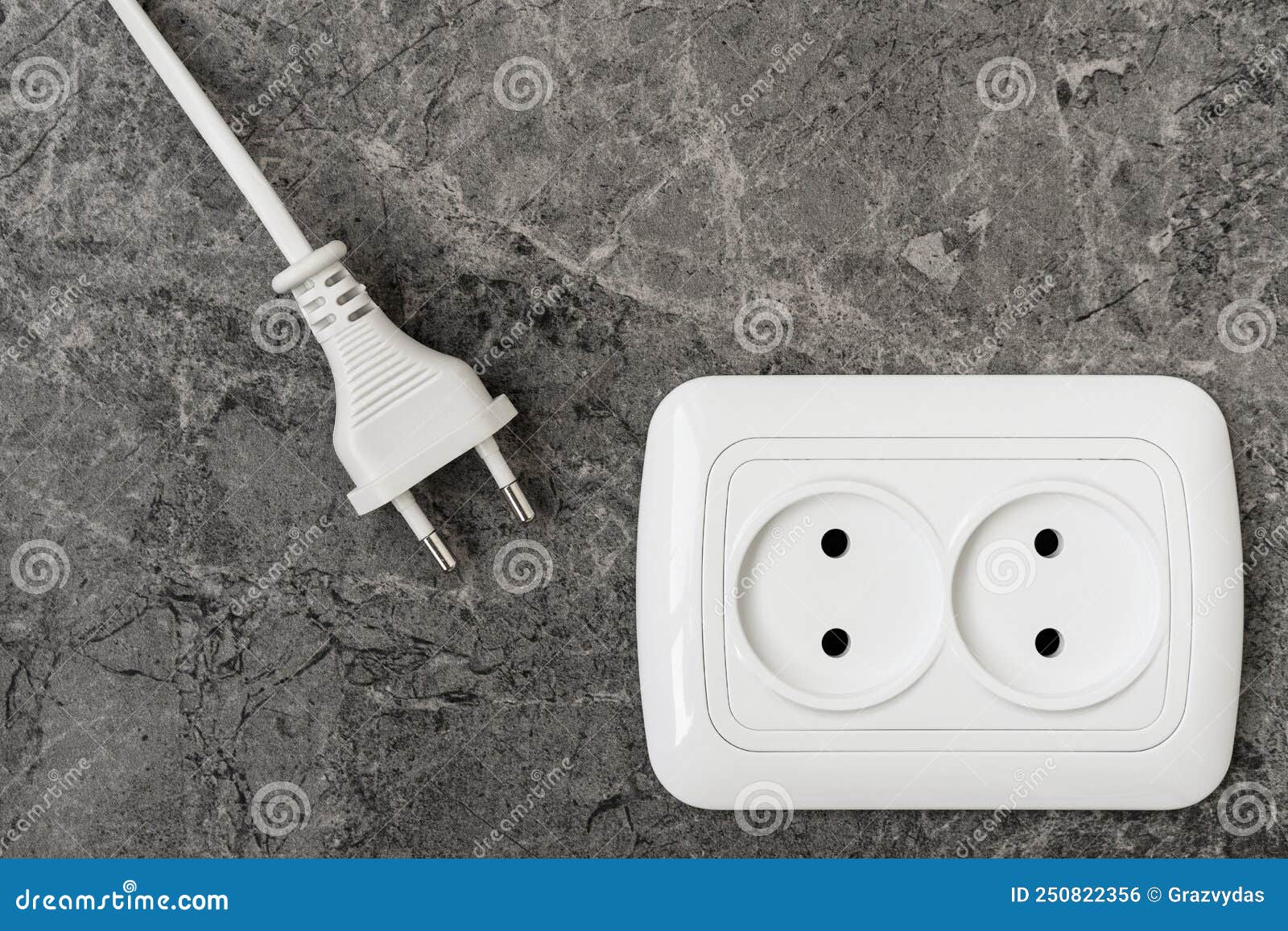 White Power Plug and Electric Socket on Stone Wall Stock Photo - Image ...