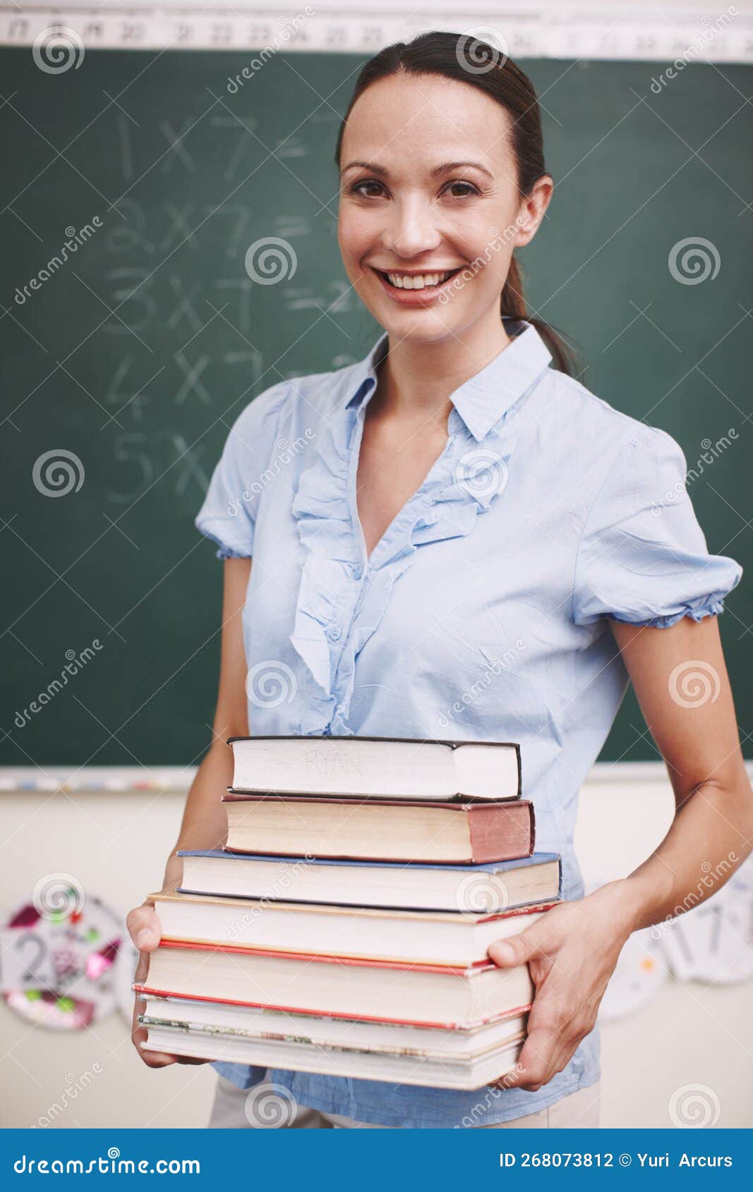 Ready To Give An Awesome Lesson Portrait Of A Pretty Teacher Carrying