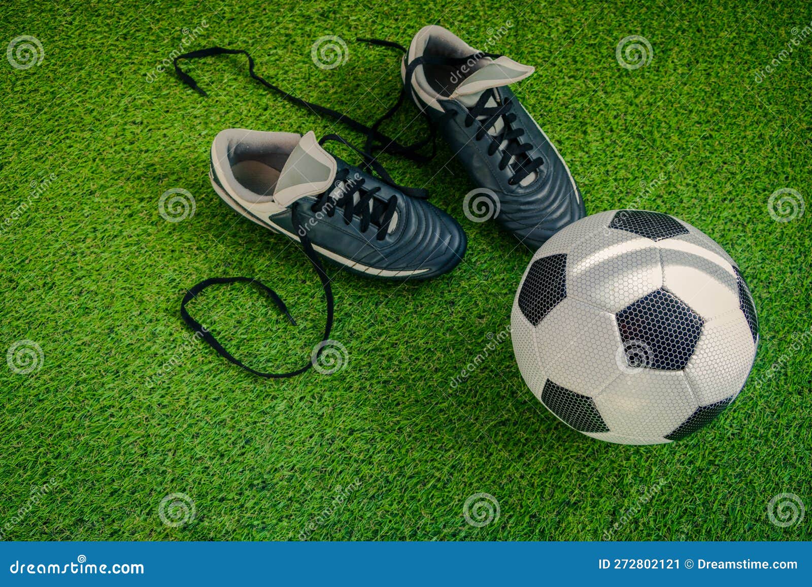 Ready for Victory: Boots and Ball on the Pitch Stock Image - Image of ...