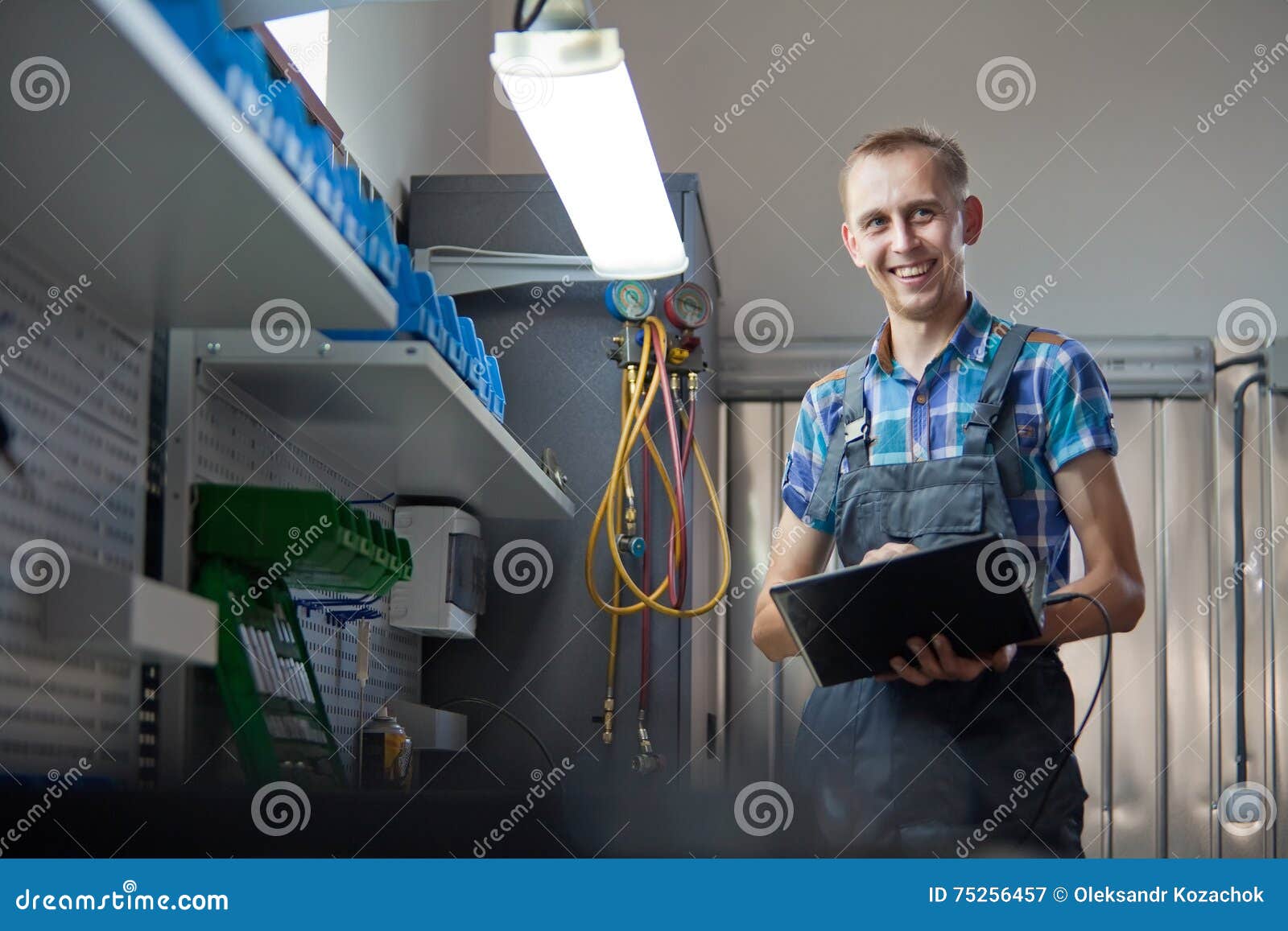 Real Auto Mechanic Worker in Garage. Auto Service and Diagnostic Stock ...