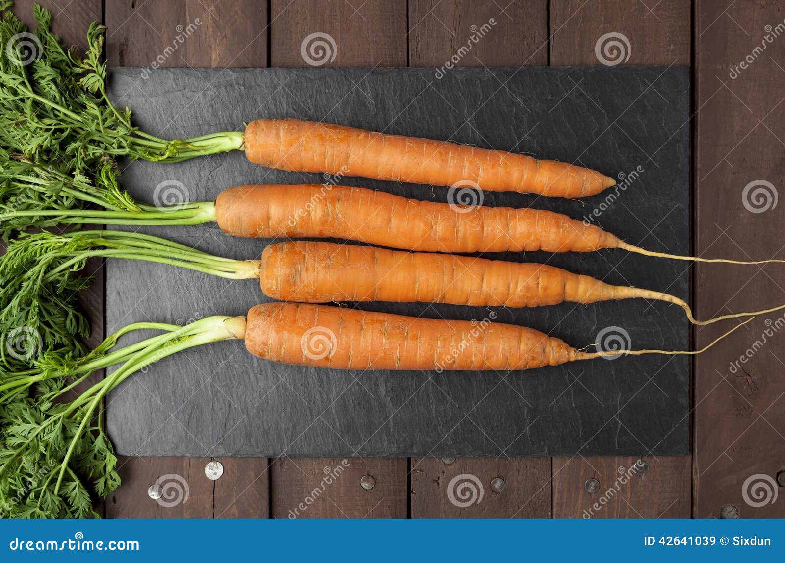 Real Carrots on Slate Plate Stock Image - Image of space, heap: 42641039