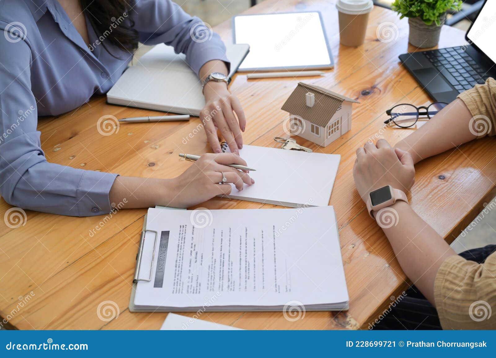 Real Estate Agent Explaining Contract Details for Customer. Stock Image ...