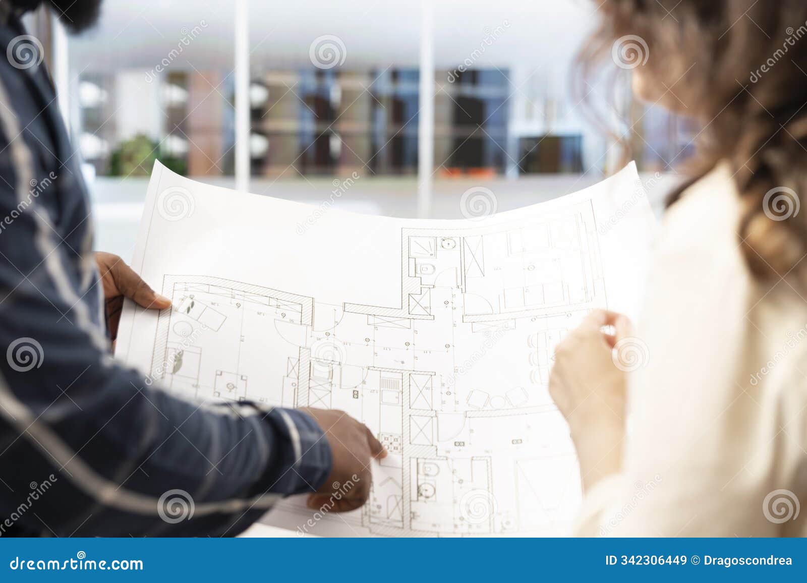 Real Estate Agent Explaining Office Space Layout To Client Using ...