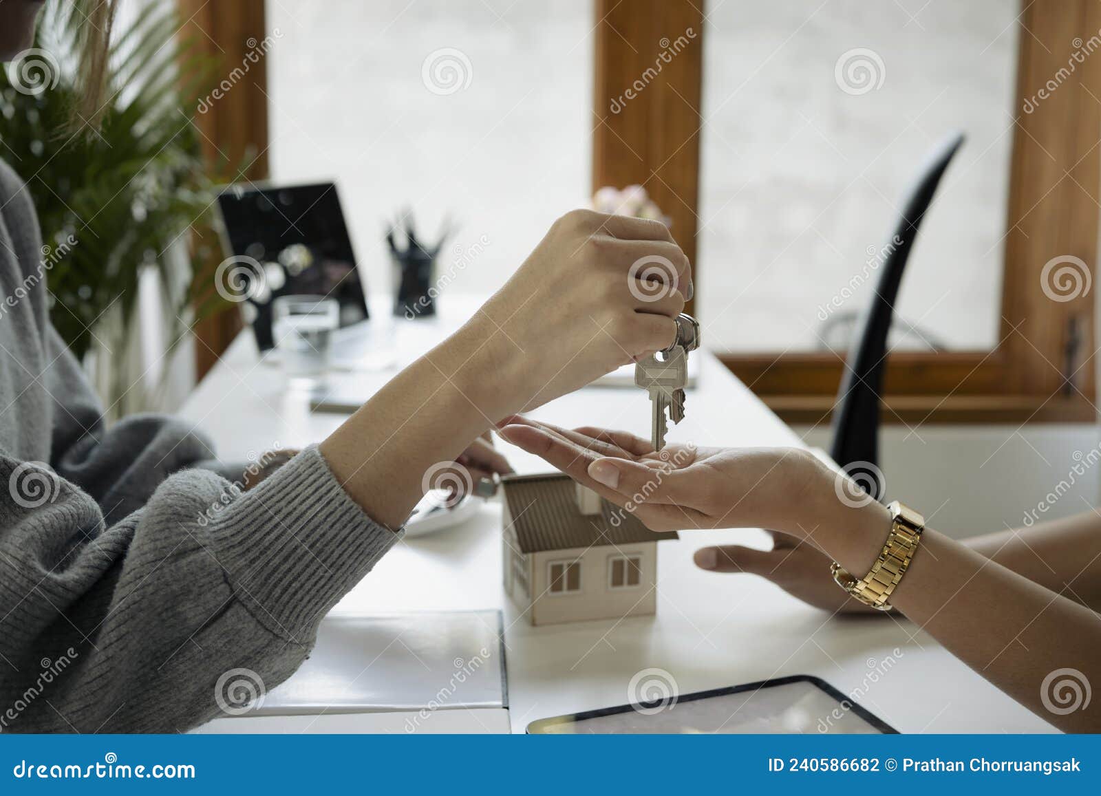 Real Estate Agent Giving House Keys To Client after Signing Contract ... Real Estate Agent Giving House Keys To Client after Signing Contract ...