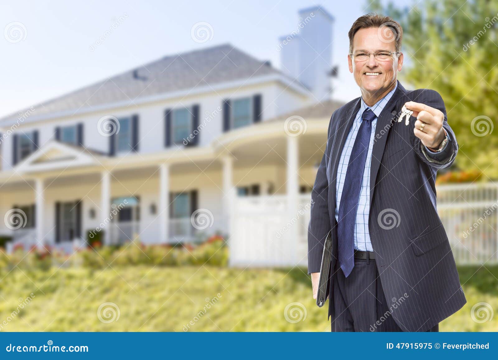 Real Estate Agent with House Keys in Front of Home Stock Image - Image ...