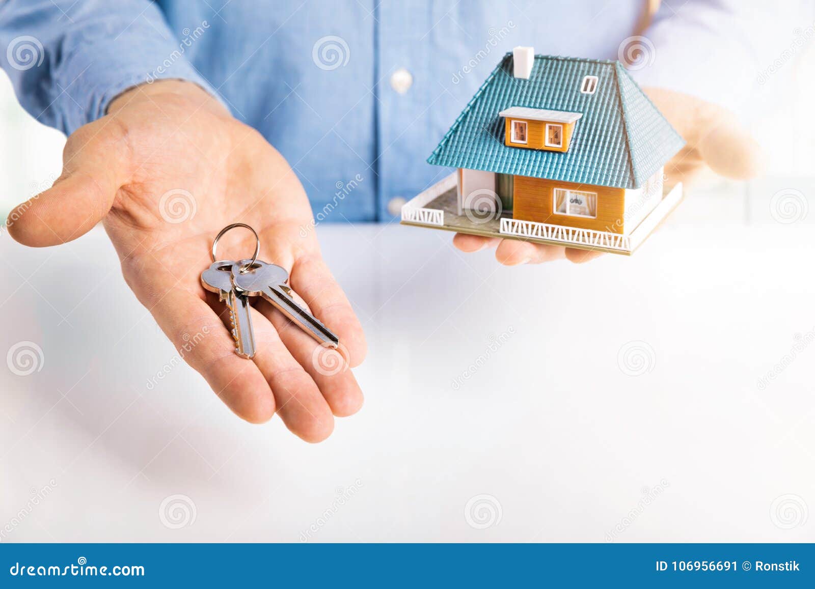 Real Estate Agent with House Model and Keys in Hands Stock Image ...