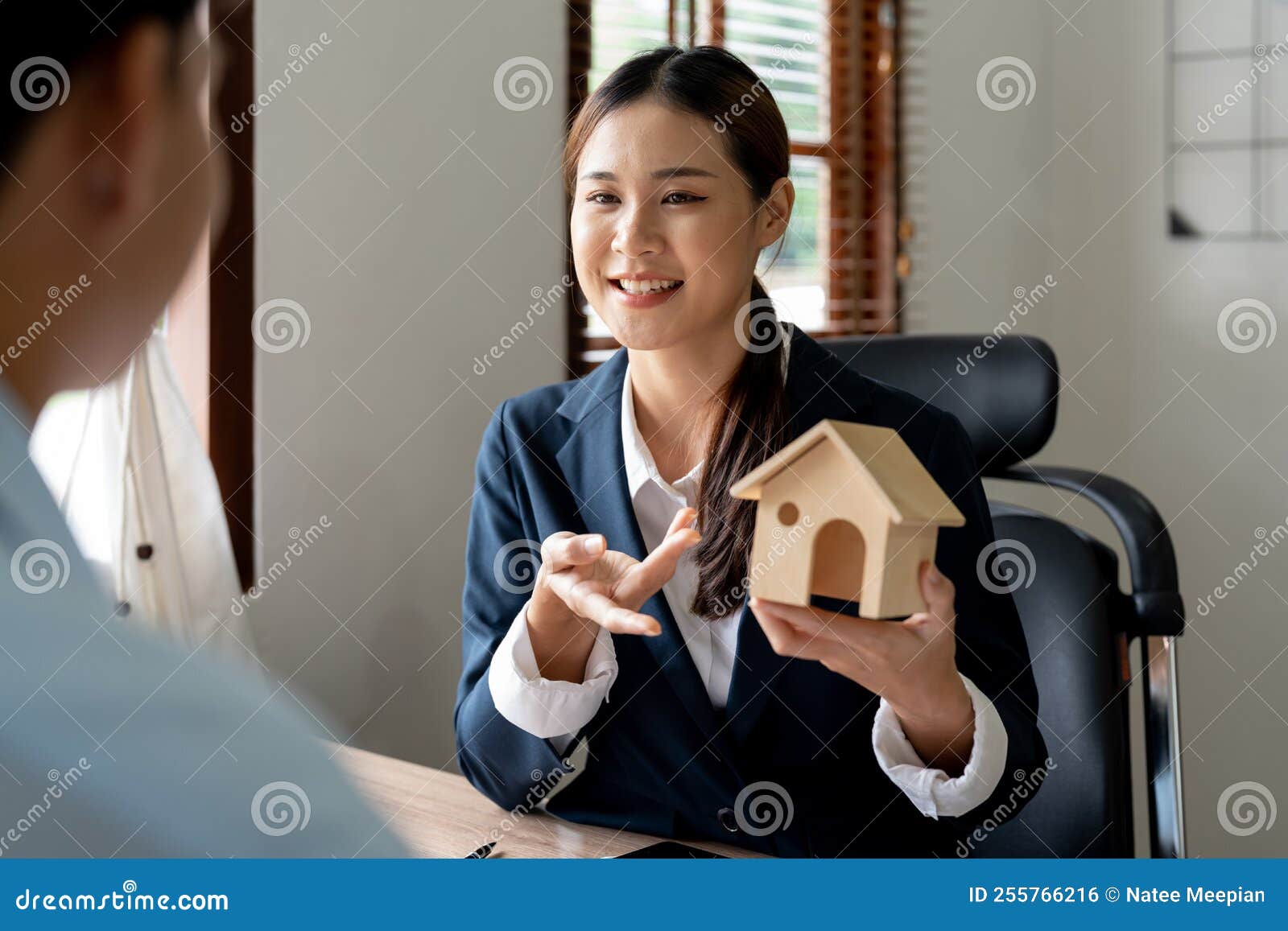 Real Estate Agent Offer House Represented by Model To Client. Stock ...