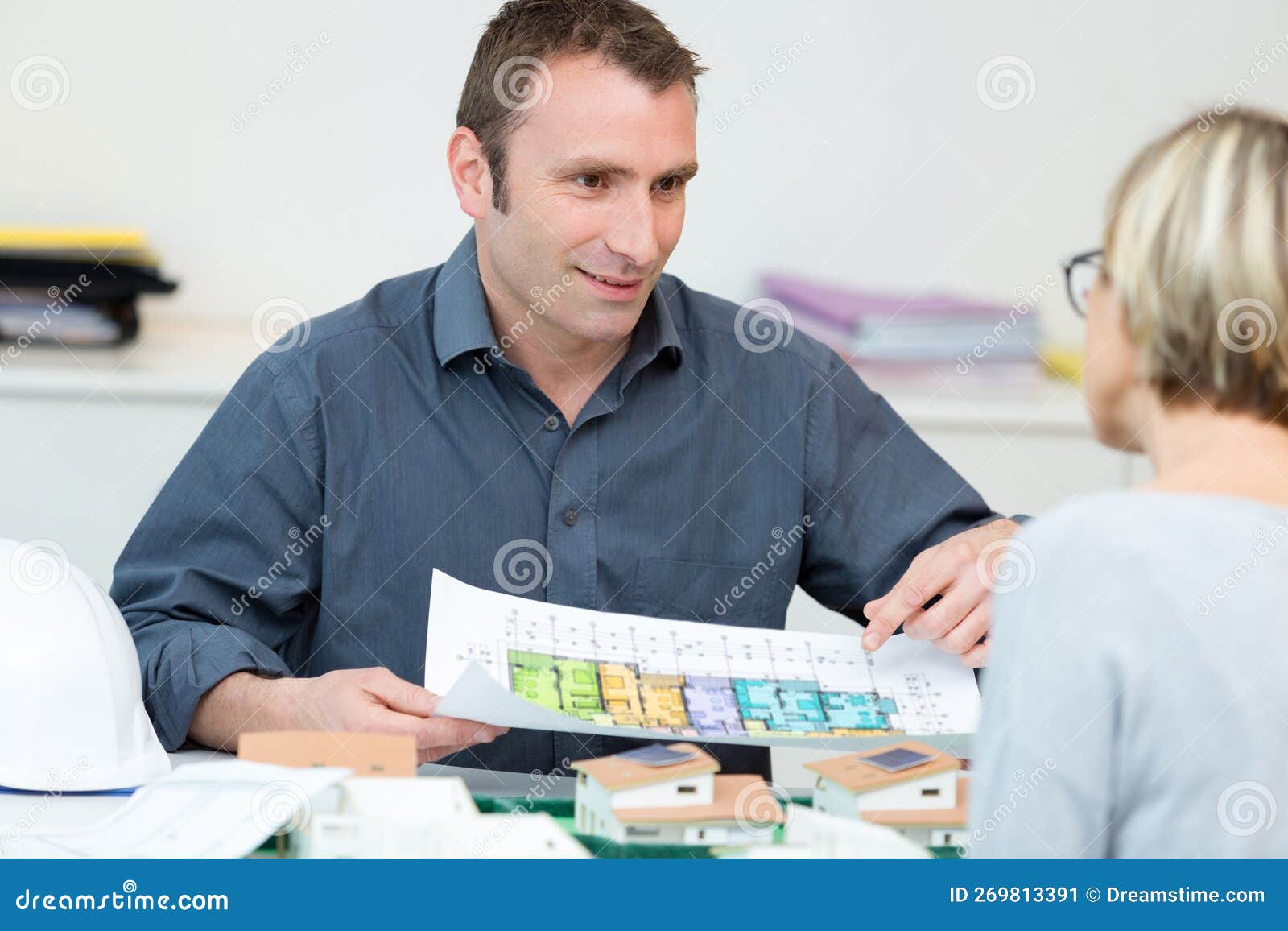 Real Estate Agent Showing Floor Plan To Client Stock Image - Image of ...