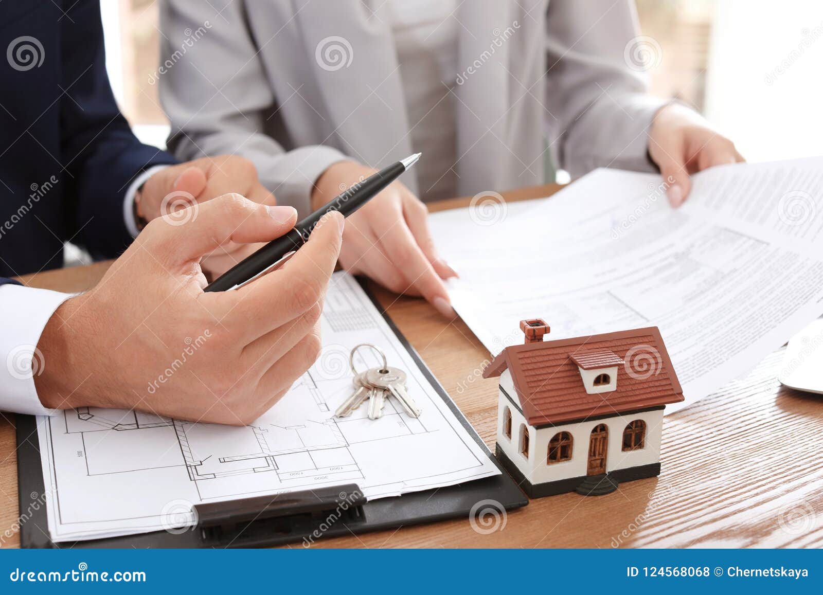 Real Estate Agent Working with Client in Office Stock Photo - Image of ...