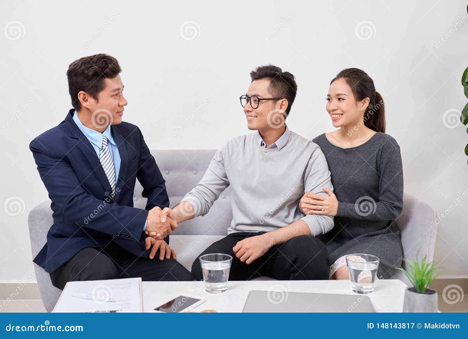 Real Estate Agent Working with Clients in Office Stock Image - Image of ...