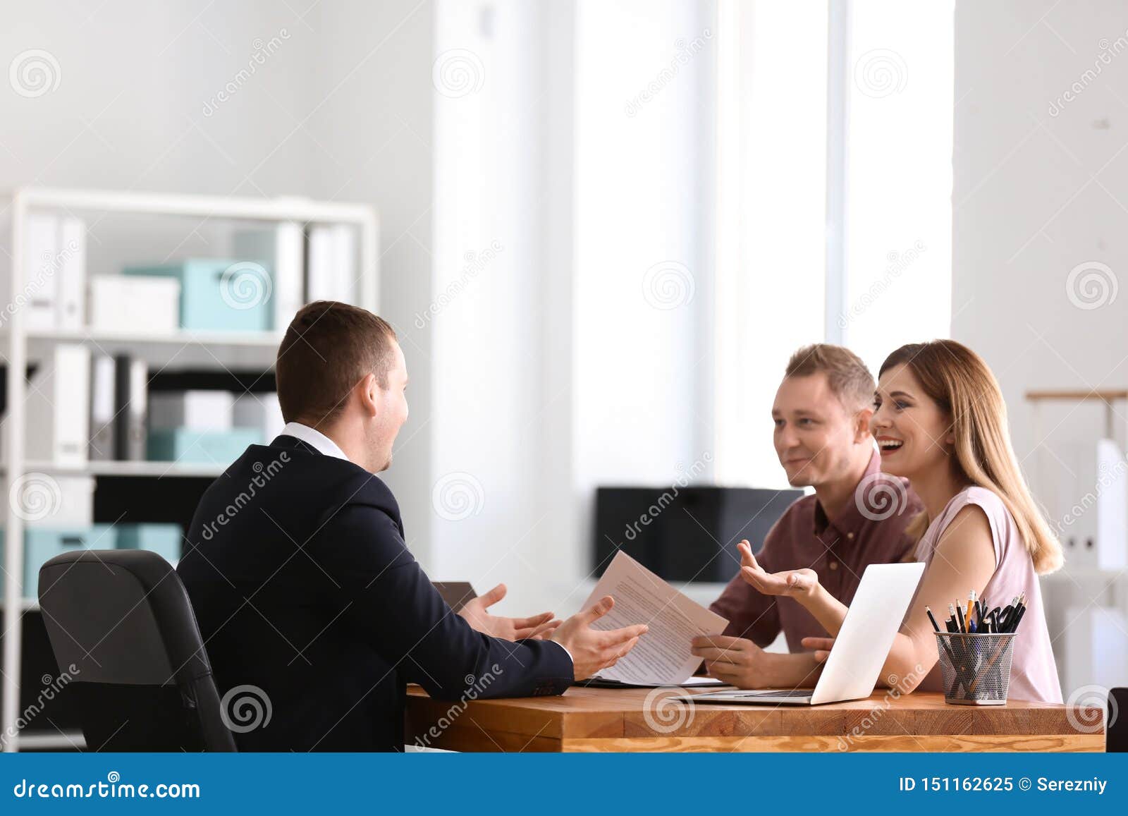 Real Estate Agent Working with Clients in Office Stock Image - Image of ...