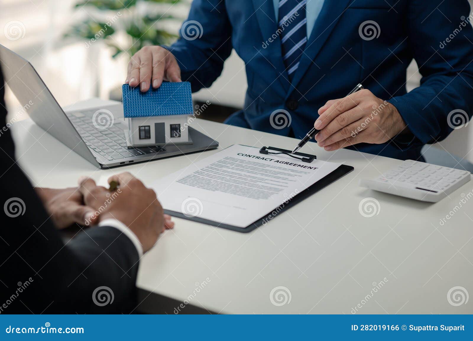 Real Estate Agents Explain Models of Housing Estates in Projects To ...