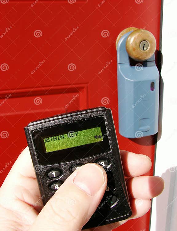 Real Estate Lock Box and Electronic Remote in Hand Stock Image - Image ...