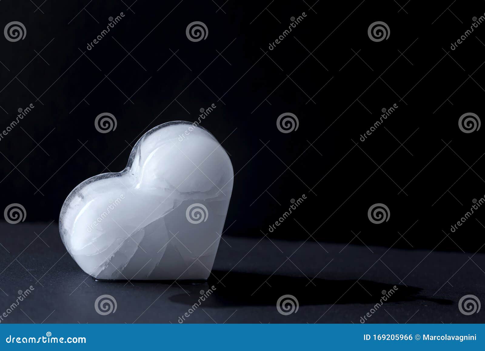 Real Ice Heart on a Dark Surface Stock Photo - Image of dark, liquid ...