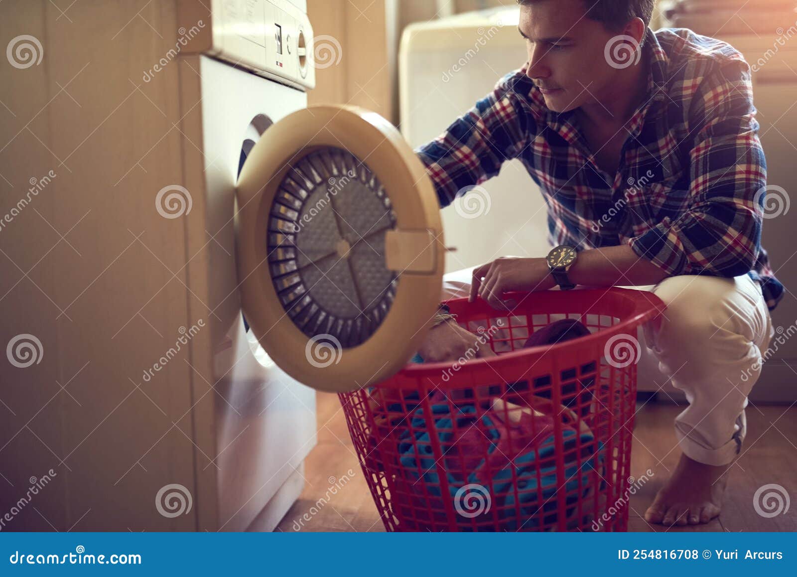 Real Men Do the Laundry. a Young Man Doing Laundry at Home. Stock Photo ...