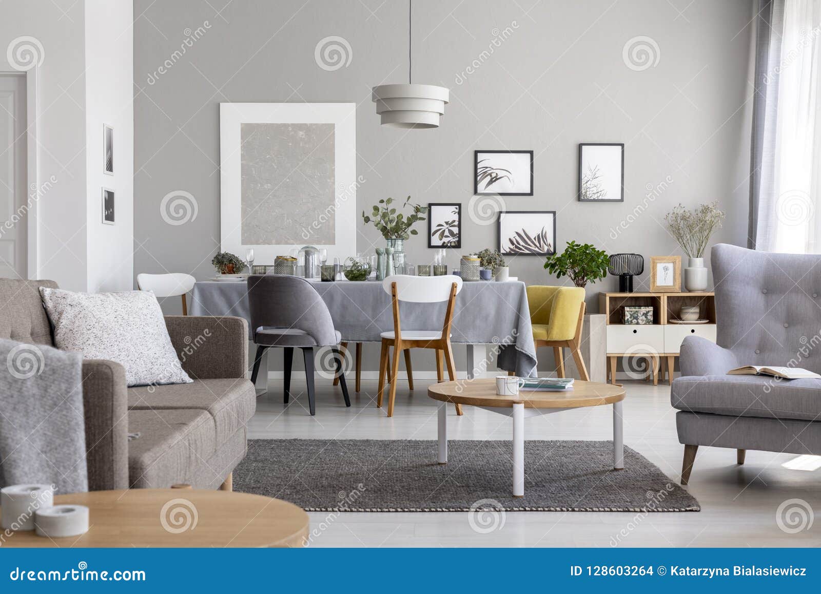 Modern Living Room Interior with a Dining Table and Graphics on a Wall ...
