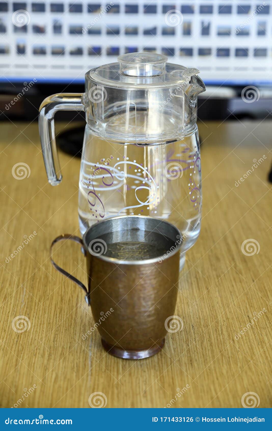 Real and Pure Copper Mugs with Glass Pitcher Jug of Water on the Table ...