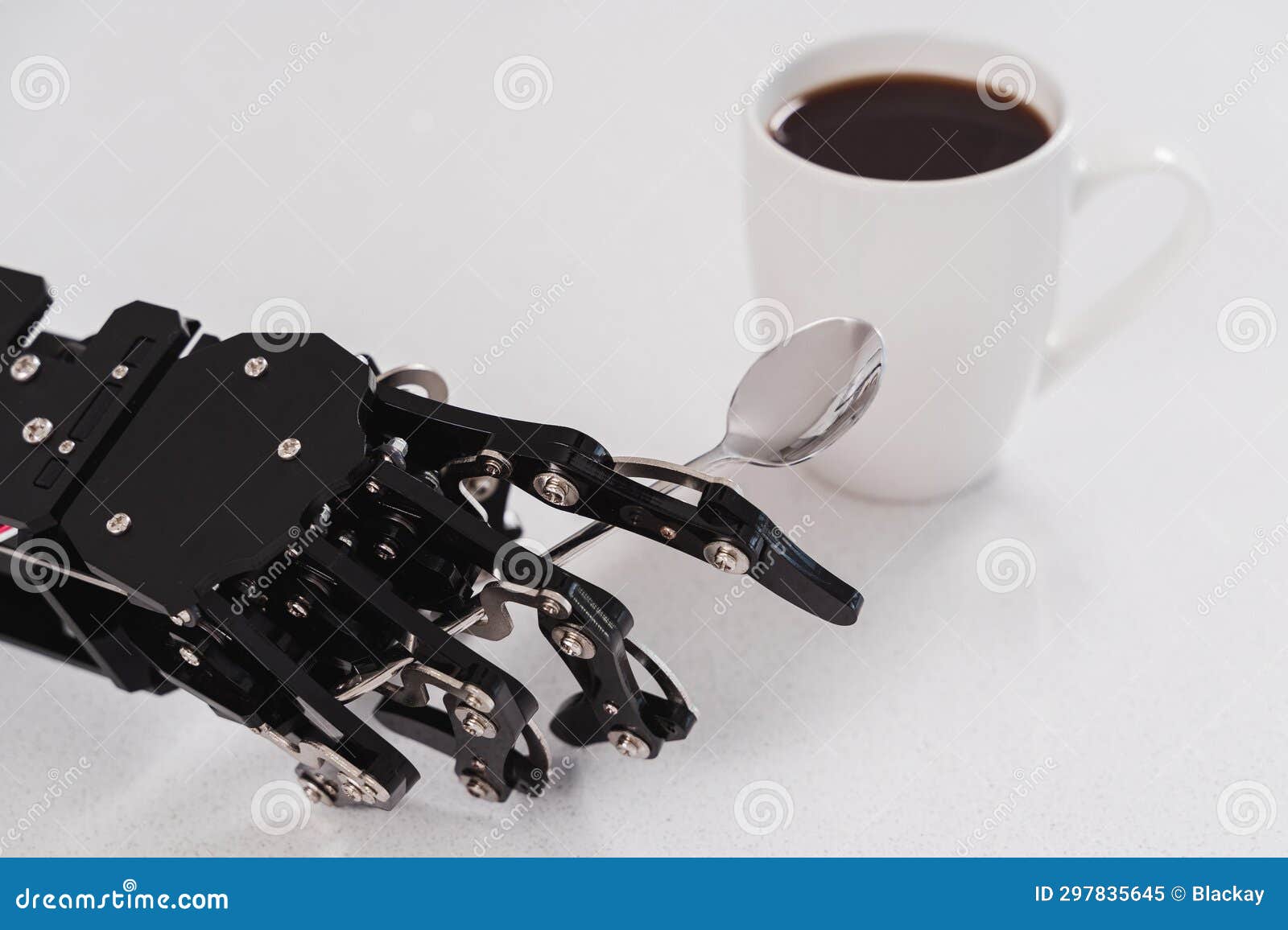 Real Robot Hand with Spoon and White Cup of Coffee. Concept of Robotic ...