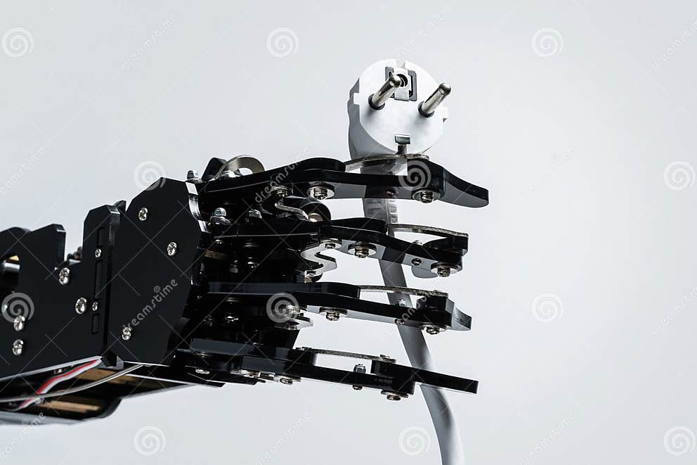 Real Robotic Hand with Power Plug. Concepts of AI Takeover and ...