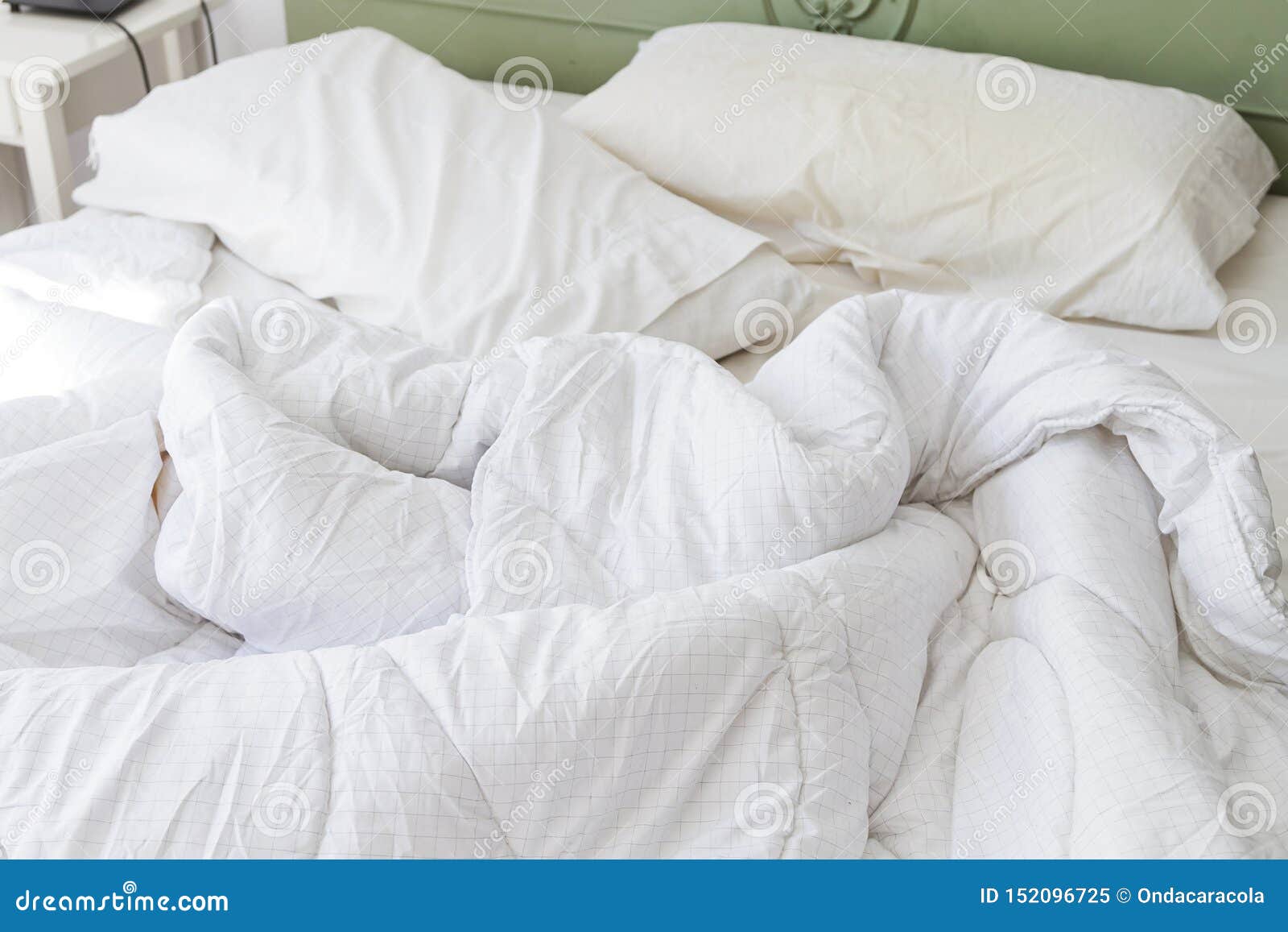 A real untidy-looking bed stock image. Image of bedding - 152096725