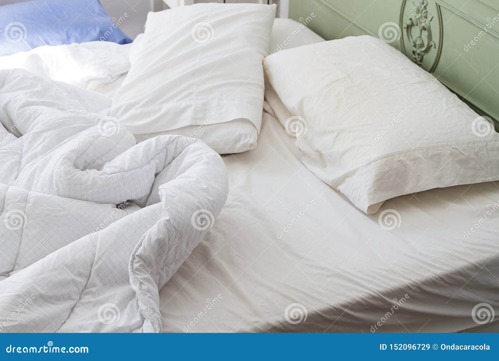 A real untidy-looking bed stock image. Image of linen - 152096729