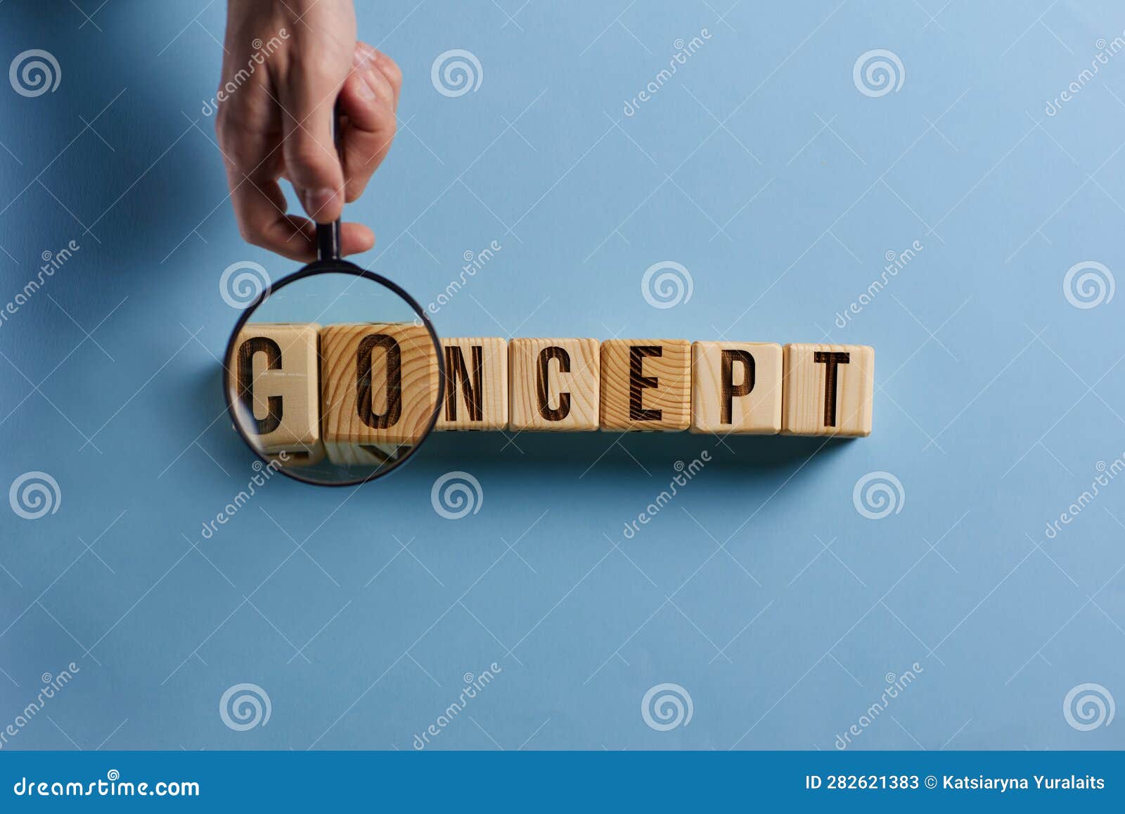 Realistic Wooden Blocks with Concept Word on Blue Table Stock Image ...