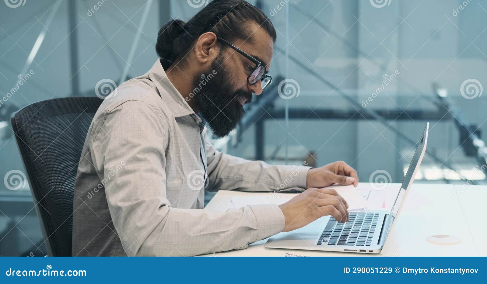 Focused Businessman Reviewing Papers and Typing on Laptop Stock Video ...