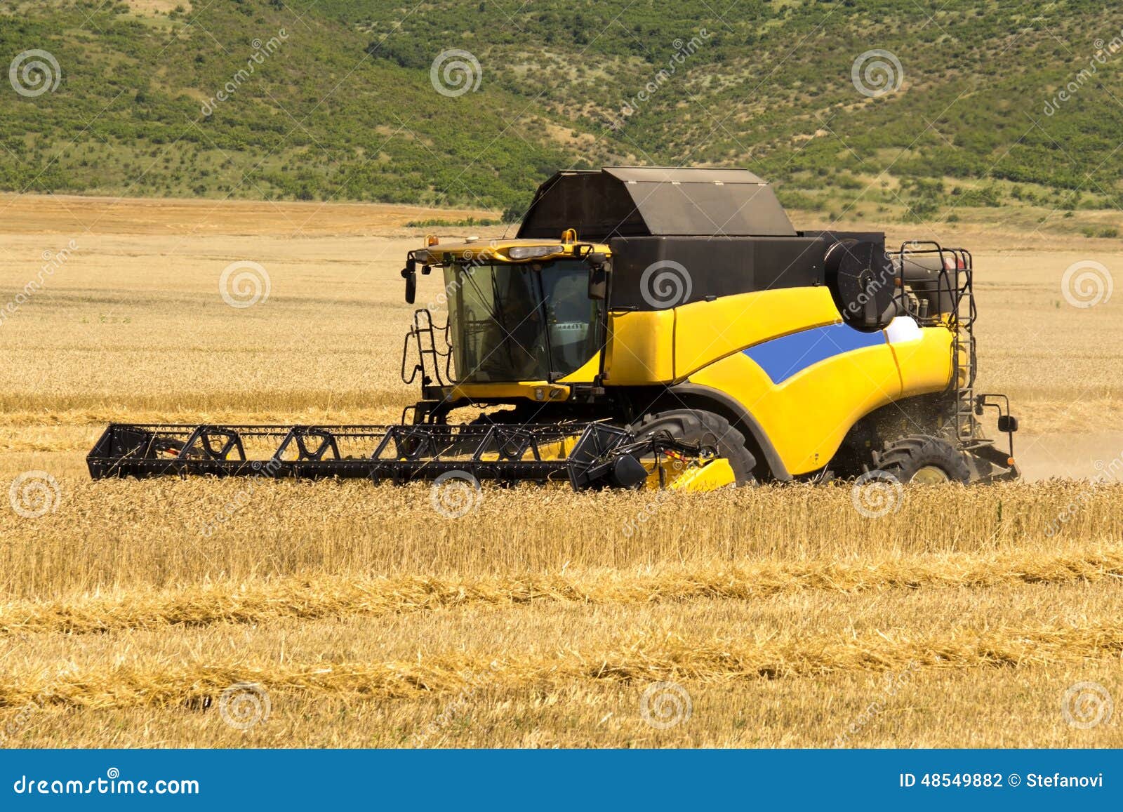 Reaping Machine or Harvester Combine on a Wheat Field with a Very ...
