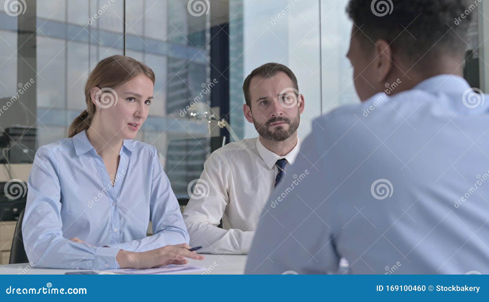 The Rear Back View of Man Having Meeting with Business People Stock ...